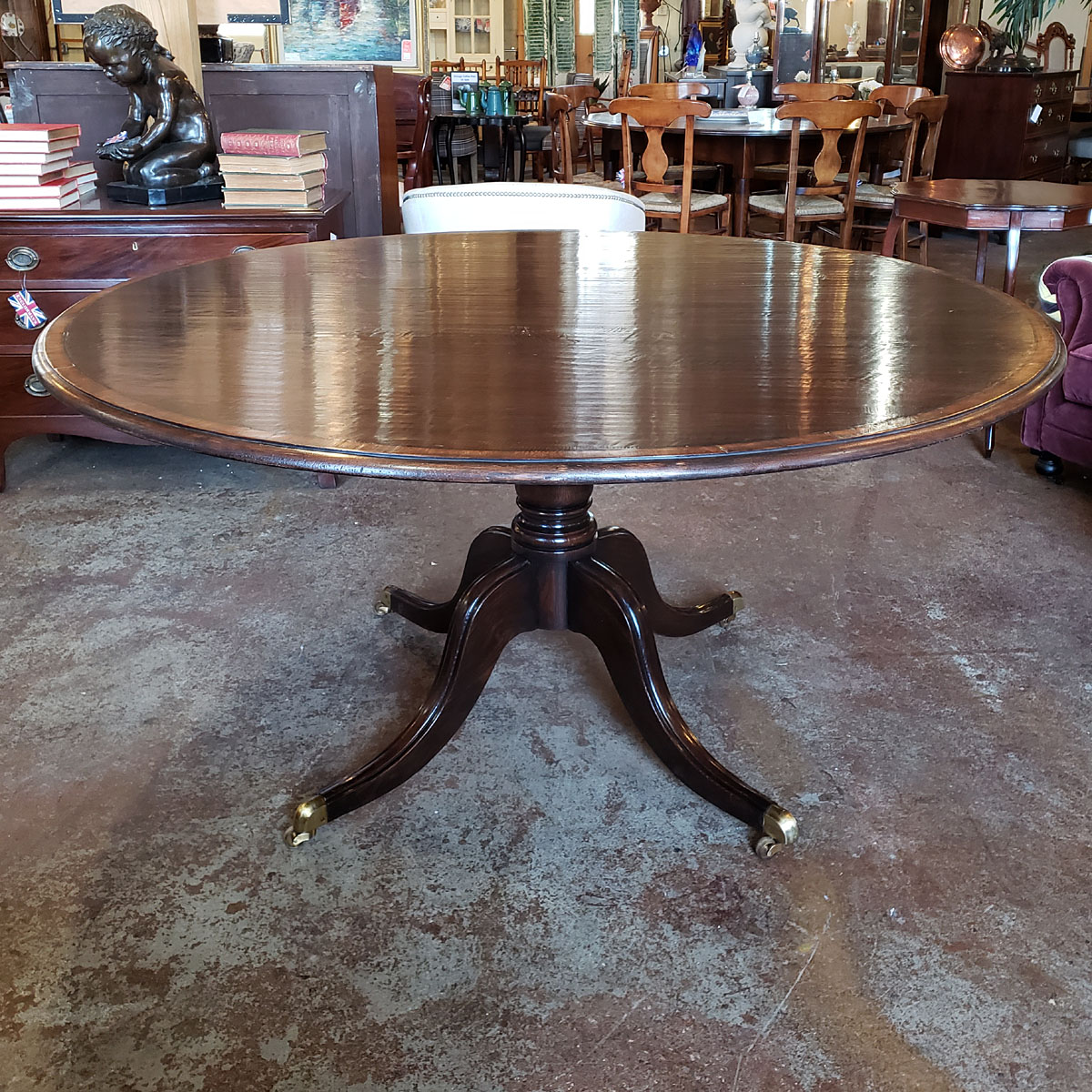 Medium oak cross banded 60 round pedestal table with casters